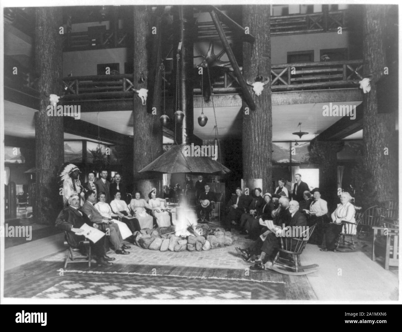Open campfire in massive forest lobby, Glacier Park Hotel Stock Photo ...