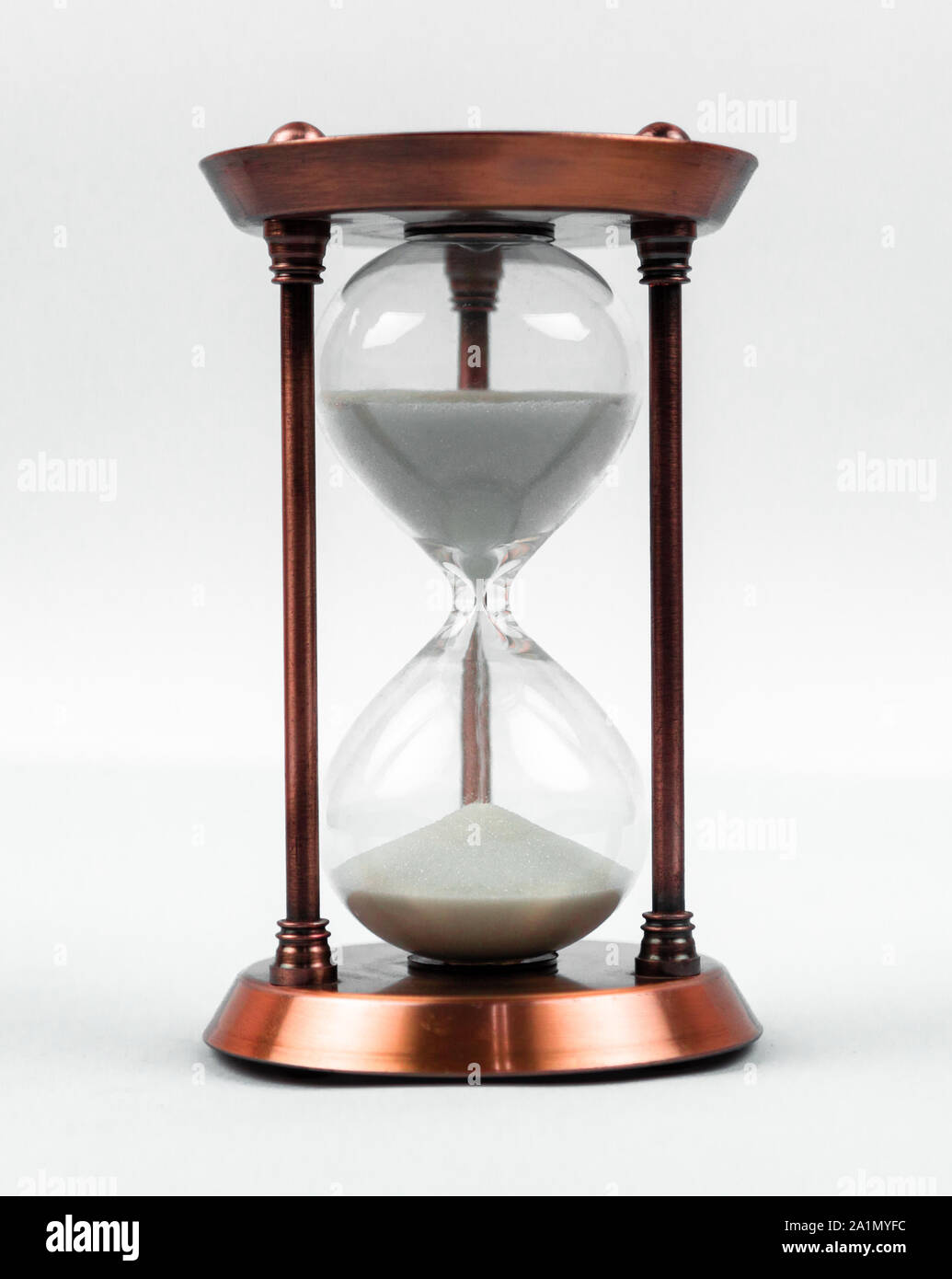 time concept with hourglass lying toned in warm black and white, retro ...