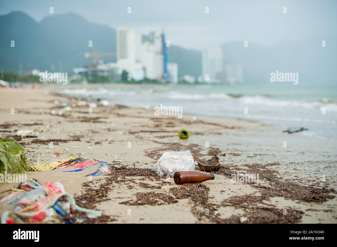 Beach pollution. Plastic bottles and other trash on sea beach Stock ...