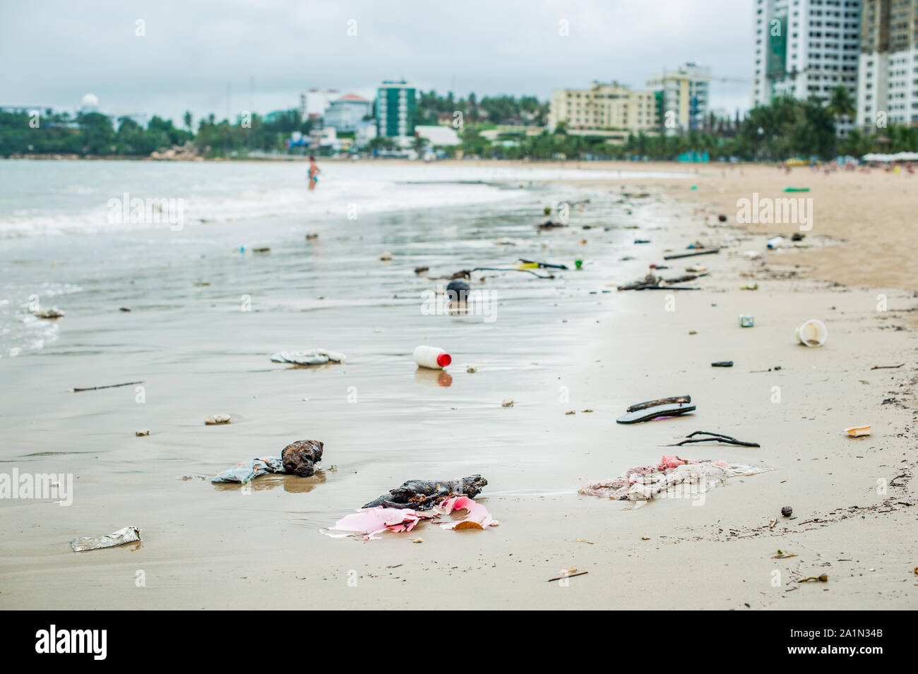 Beach pollution. Plastic bottles and other trash on sea beach Stock ...