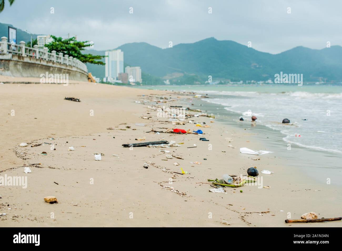 Beach pollution. Plastic bottles and other trash on sea beach Stock ...