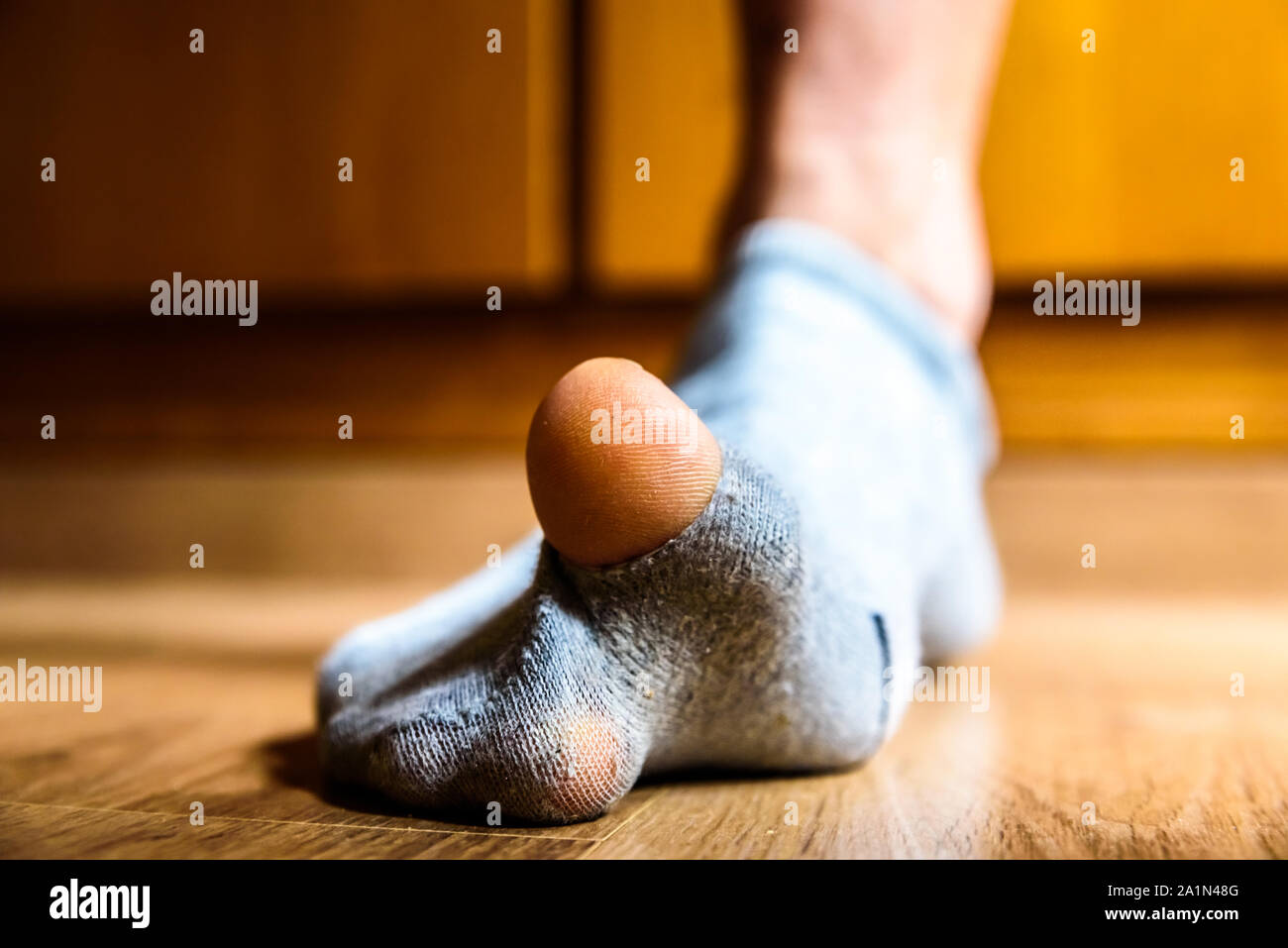 Hole in sock hi-res stock photography and images - Alamy