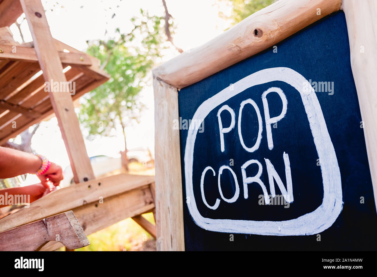 Little girl picking popcorn from a cart during a birthday party Stock ...