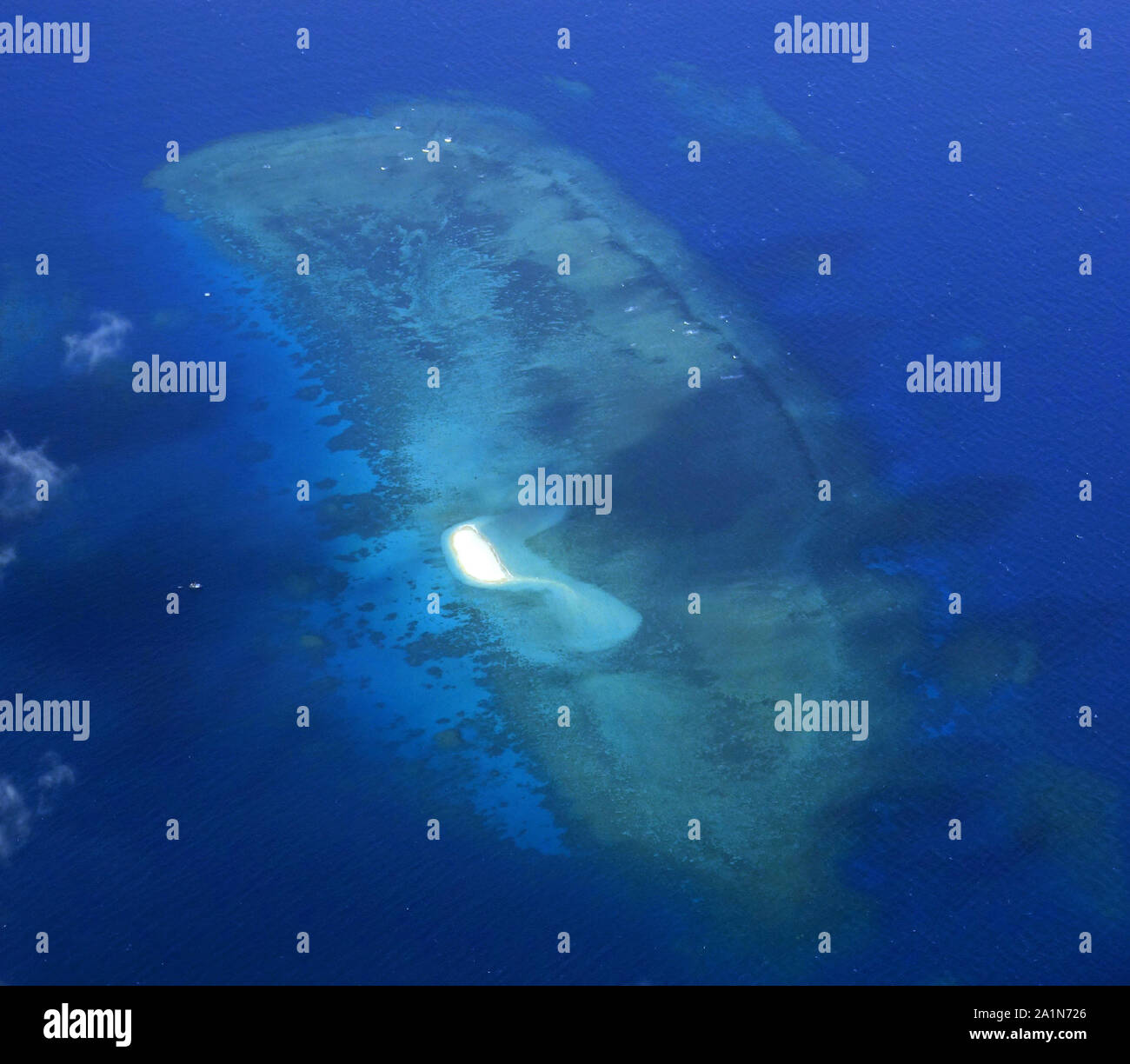 Patch reef with sand cay in the far northern Great Barrier Reef near ...