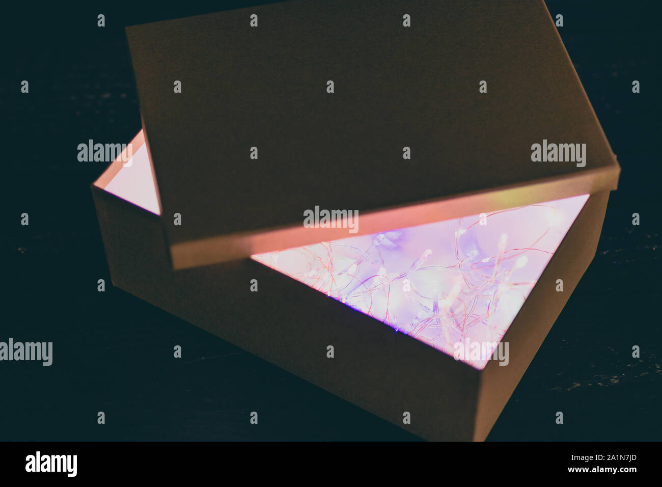 mystery box with semi-open lid revealing bright light coming from the ...