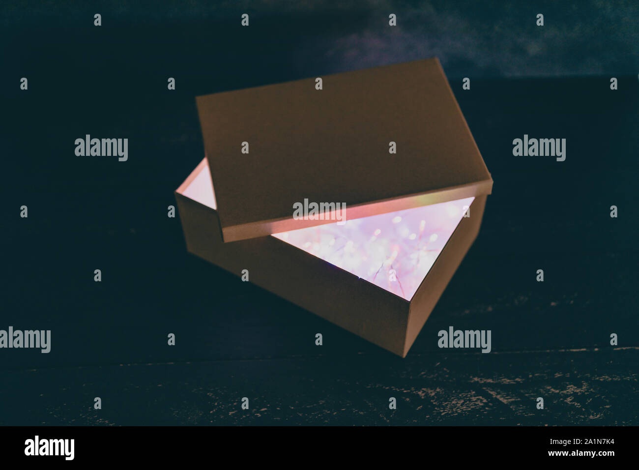 mystery box with semi-open lid revealing bright light coming from the ...