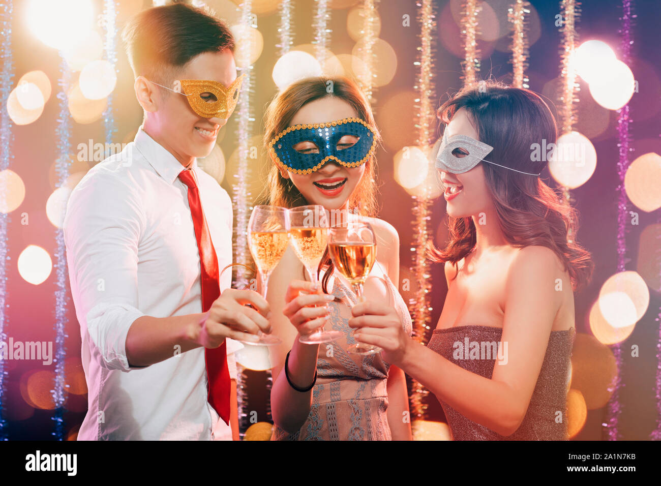 Group of people toasting night hi-res stock photography and images - Alamy