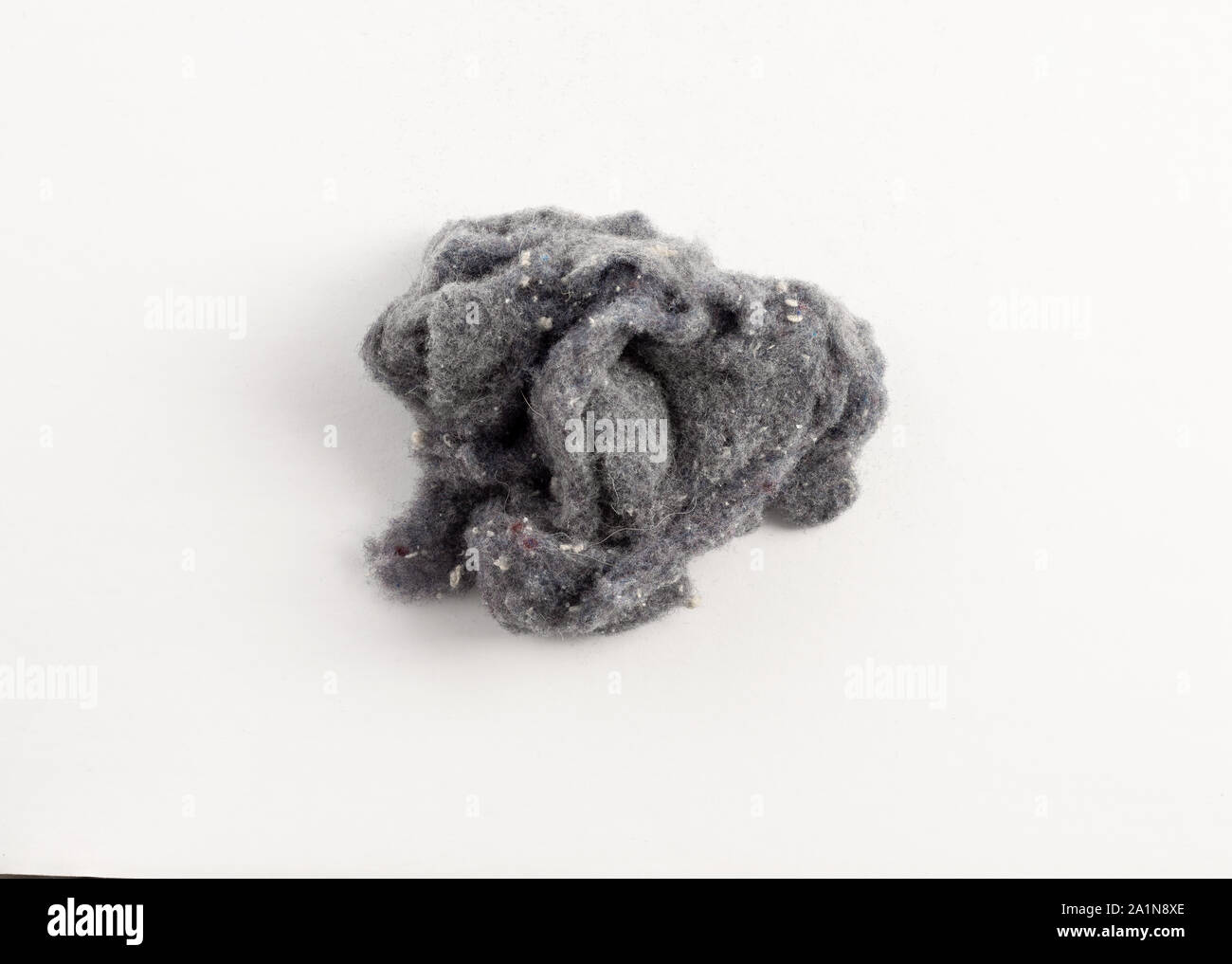 laundry lint on white background Stock Photo - Alamy