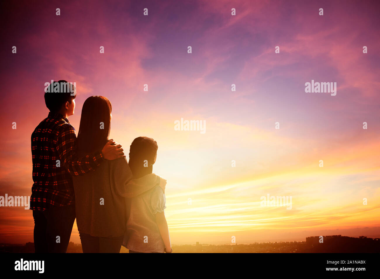 rear view family standing and watching the sunset Stock Photo - Alamy