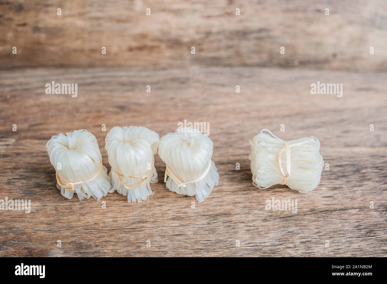 Asian uncooked noodles, tied with natural rope. Asian food concept ...