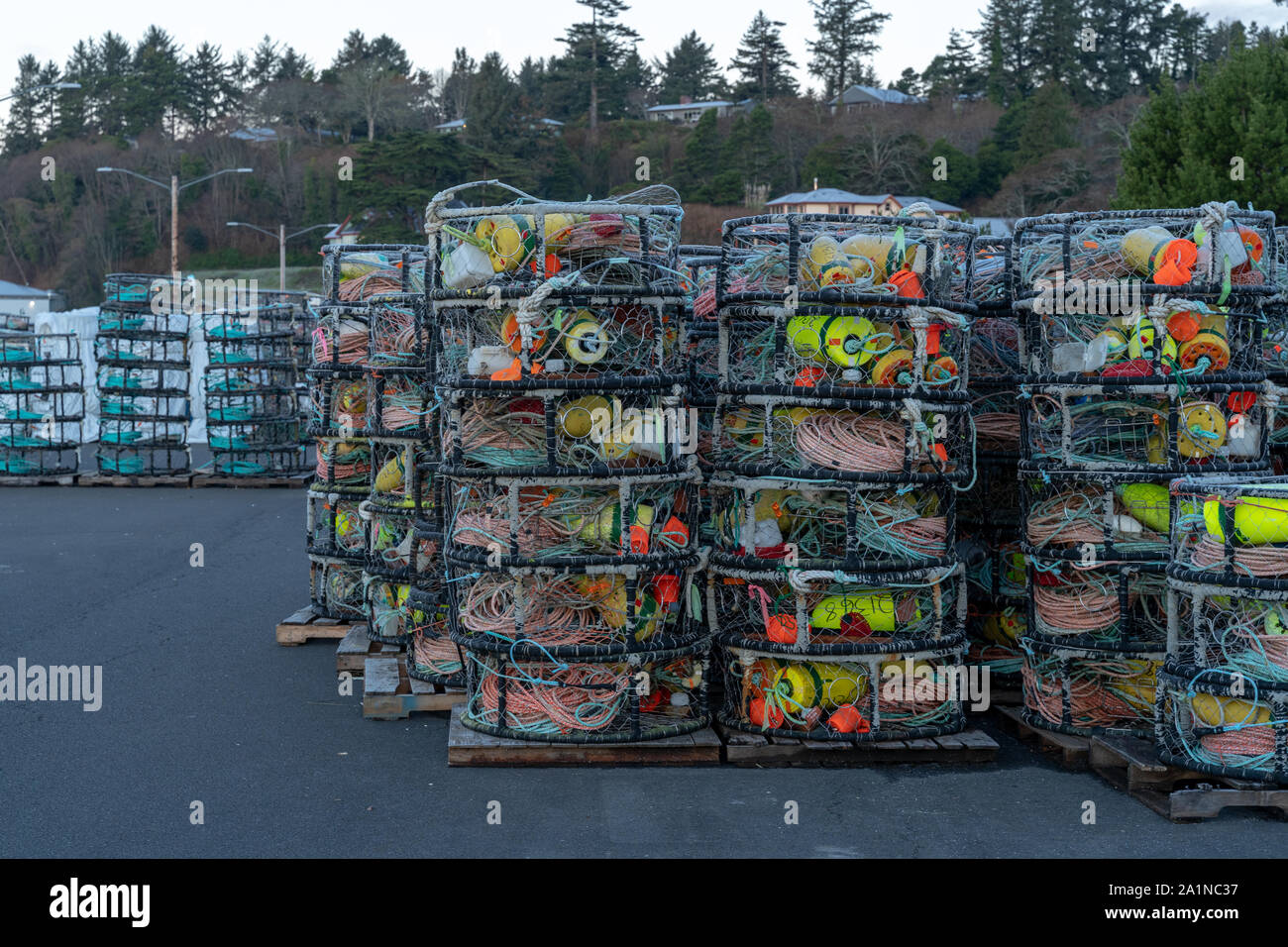 Crab traps, pots and floats, stacked on wharf,Yaquina Bay, Newport ...