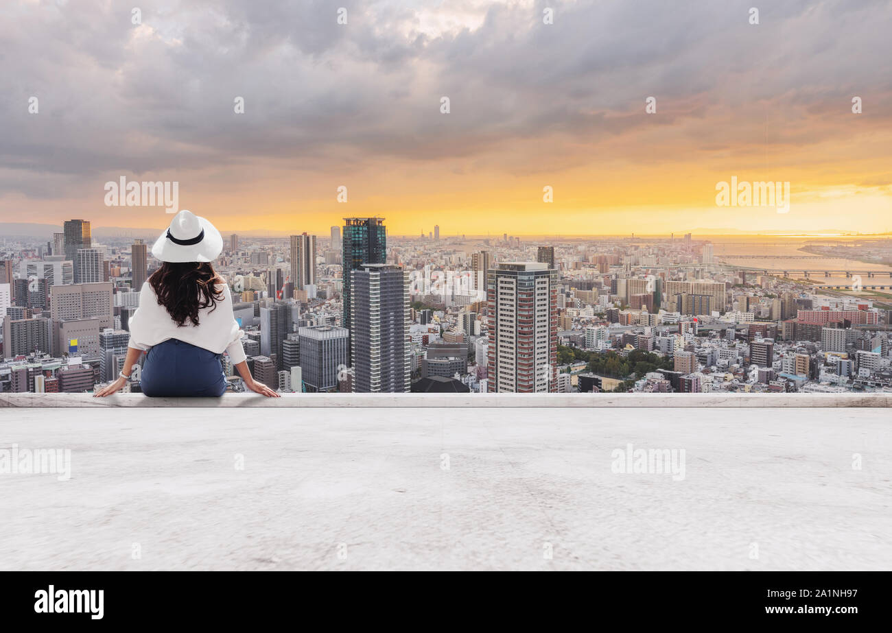 Girl sitting on terrace hi-res stock photography and images - Alamy