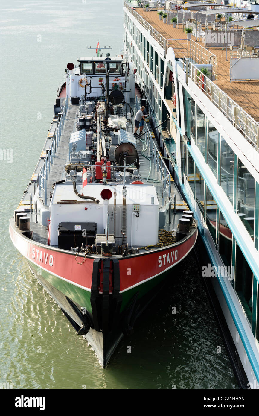 Wien, Vienna: cruise ship is fueled from tanker ship, river Donau (Danube), in Austria, Wien, 02 ...