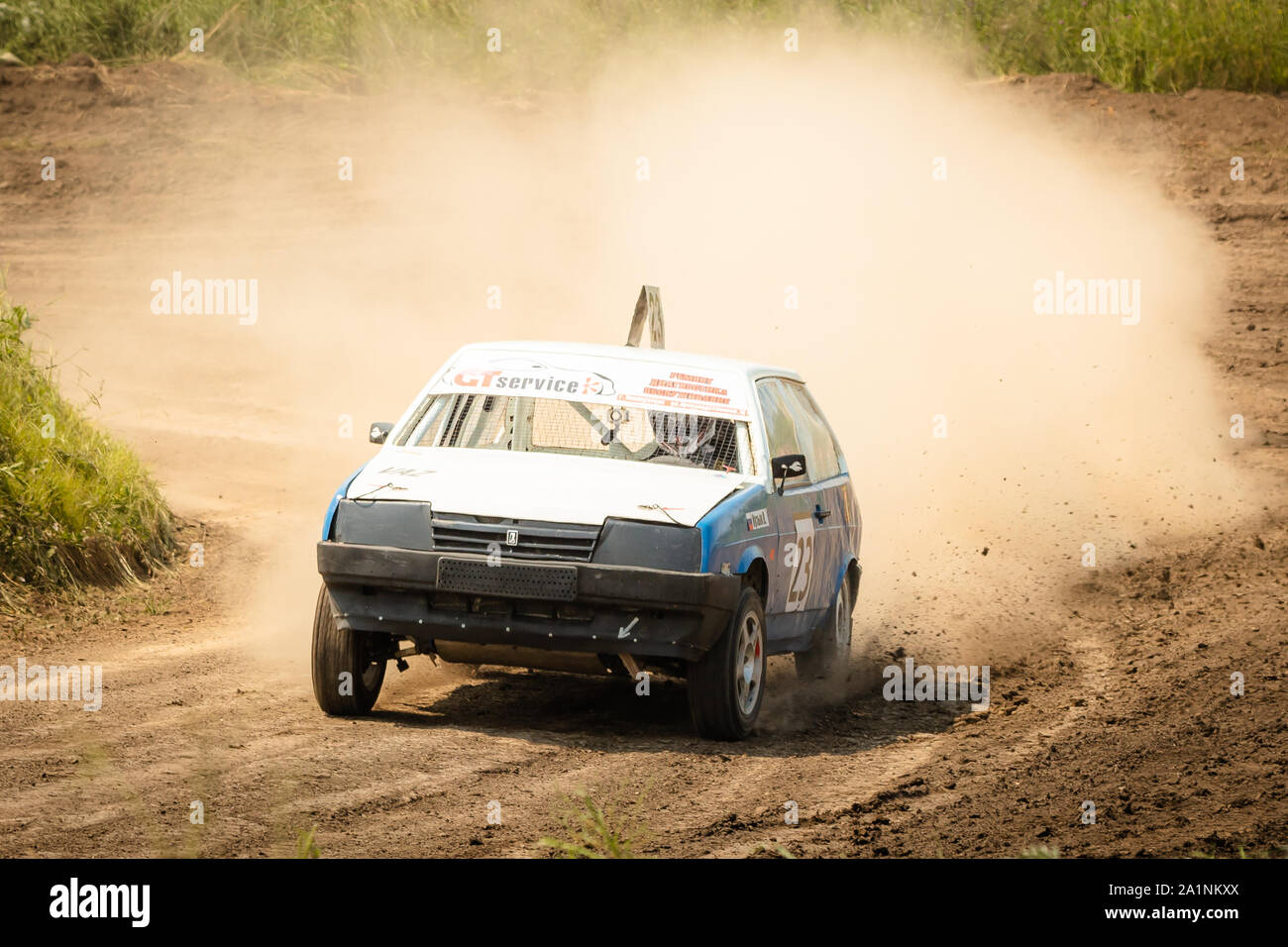Traditional rally .The racing car drives into a steep turn, scattering ...