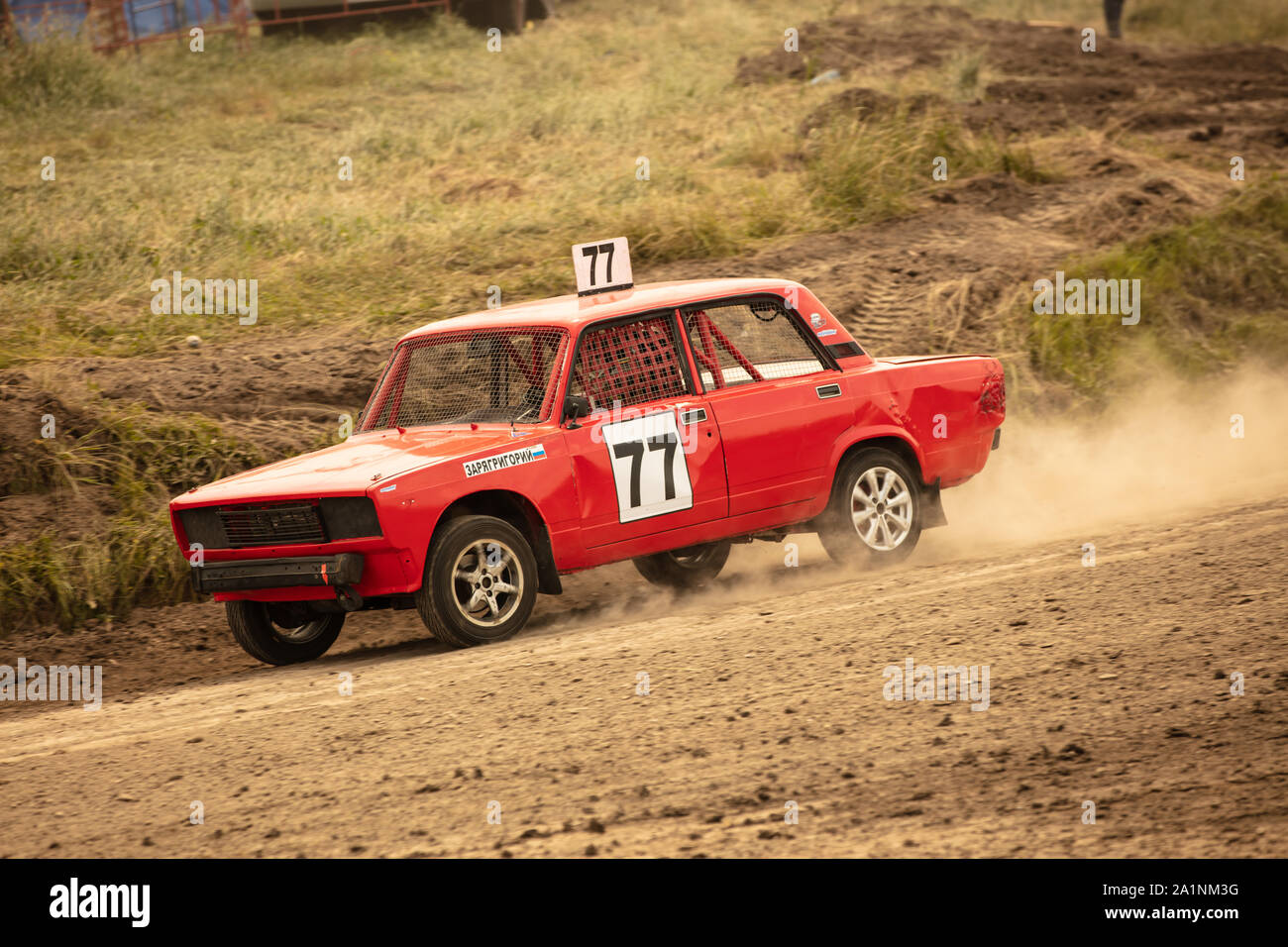 Traditional rally .The racing car drives into a steep turn, scattering ...