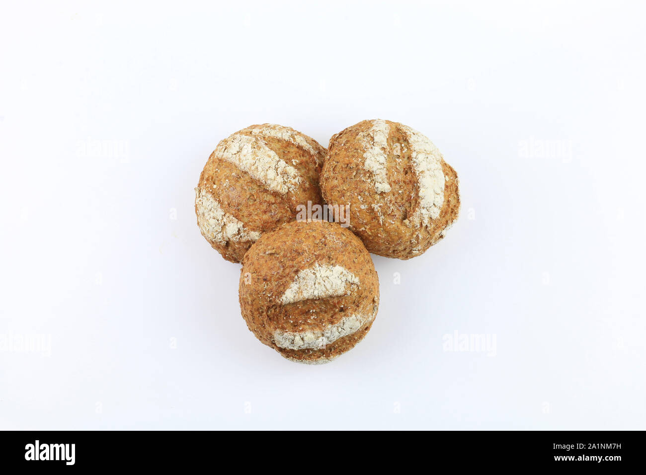 Wholemeal oval buns on a white background. Top view Stock Photo - Alamy