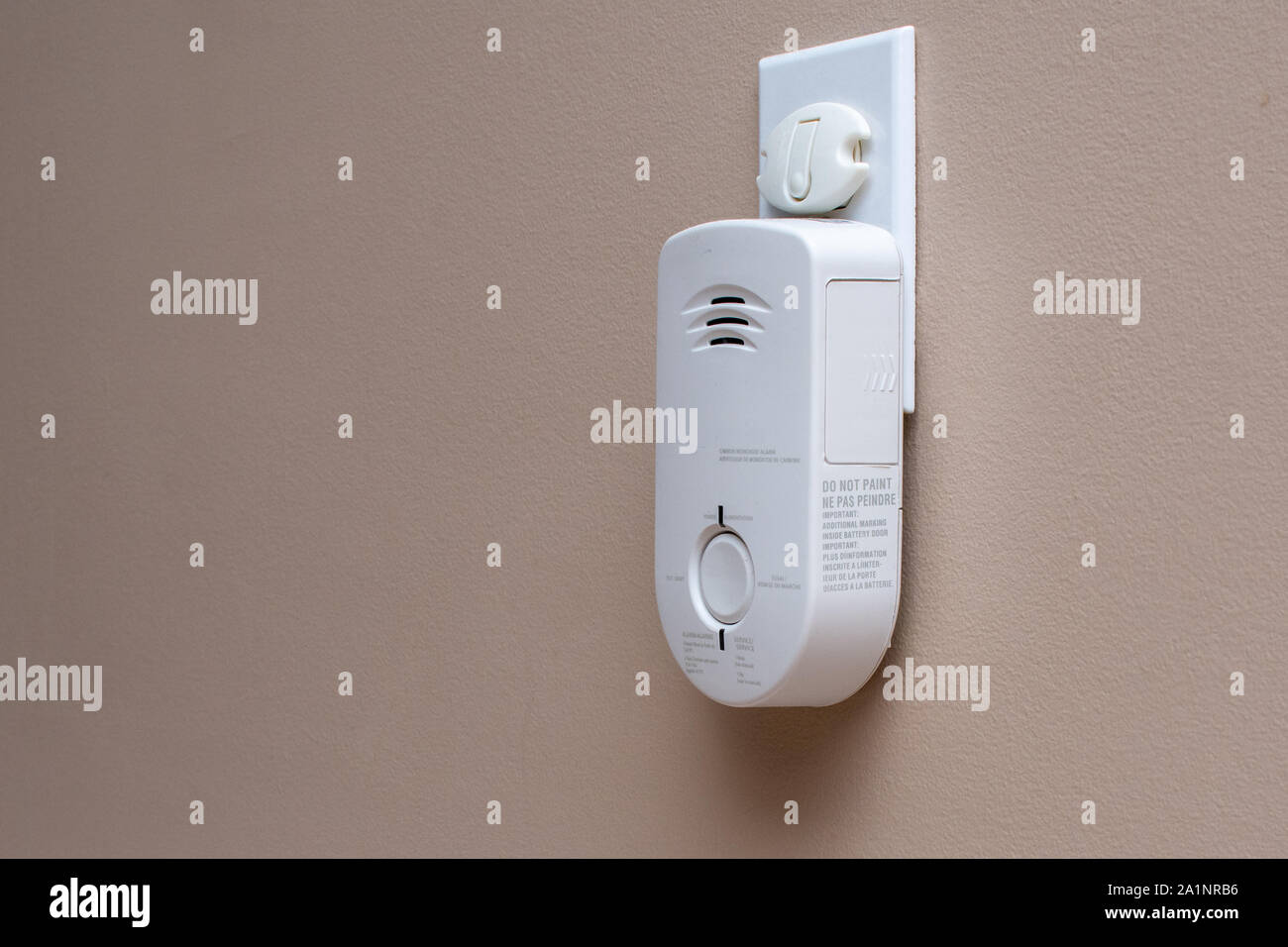 Carbon Monoxide (CO) monitor plugged into the wall of a residential ...