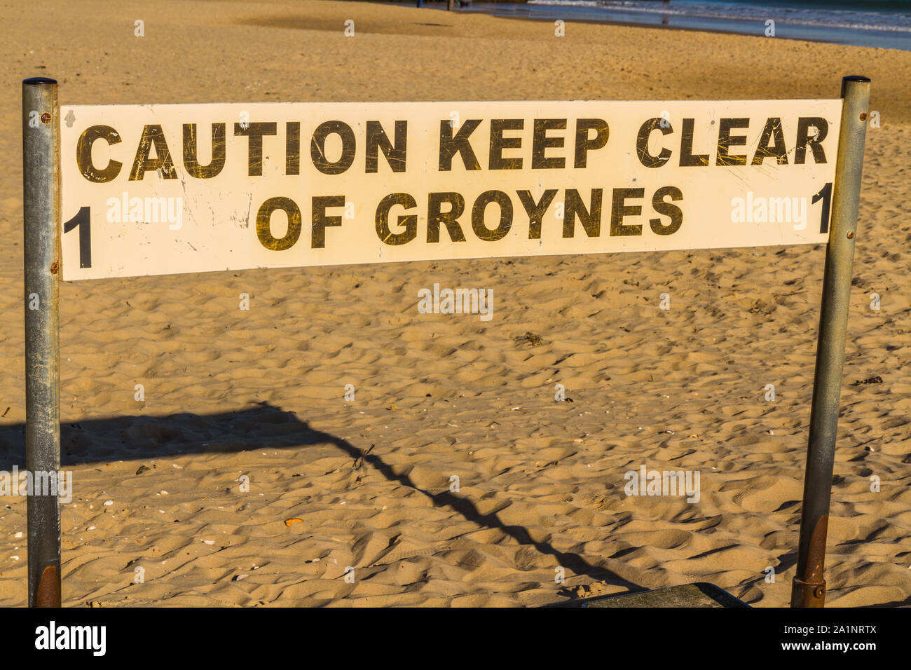 Warning sign stating caution Keep Clear of Groynes, landscape Stock ...