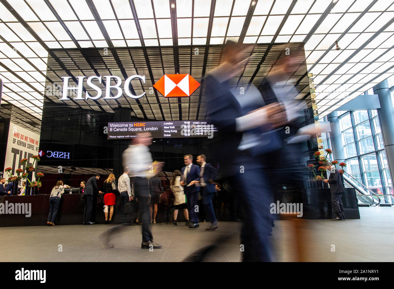 A very busy reception area of HSBC's headquarters in Canary Wharf ...