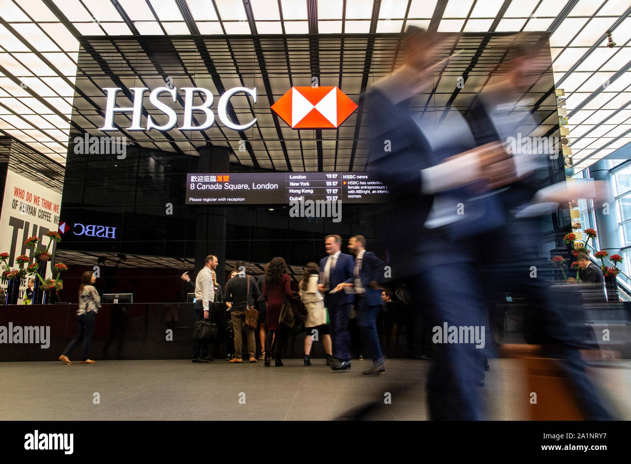 A very busy reception area of HSBC's headquarters in Canary Wharf ...