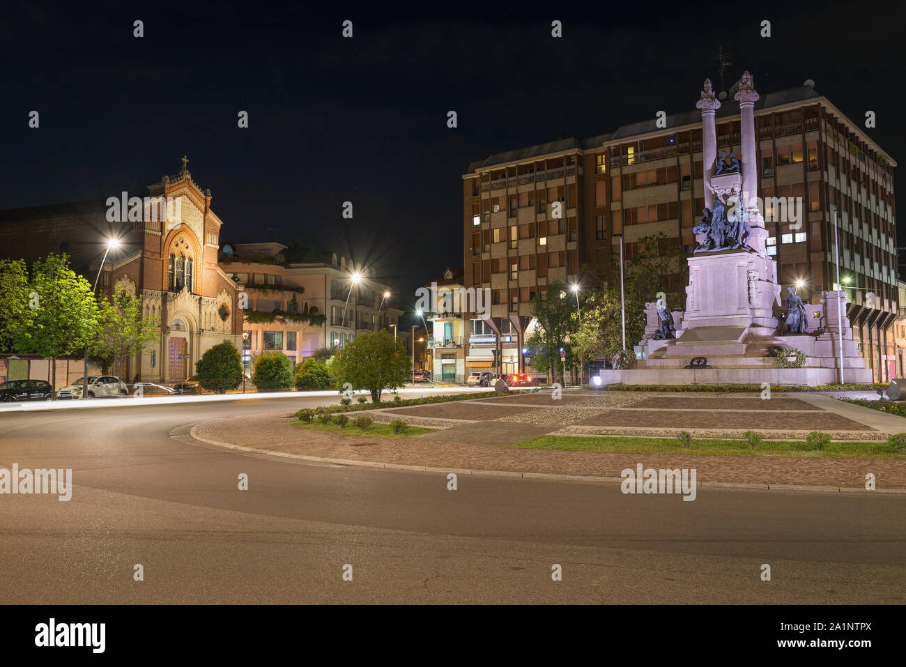 Italian city at night, art and culture. Gallarate, square Risorgimento ...