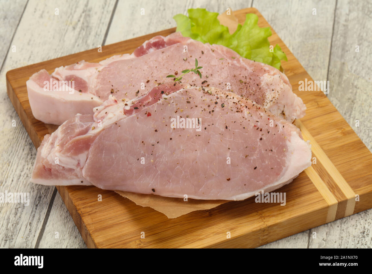 Raw pork meat steak ready for grill Stock Photo - Alamy