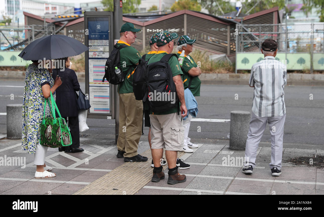 South Africa fans wait for a bus before the 2019 Rugby World Cup match ...