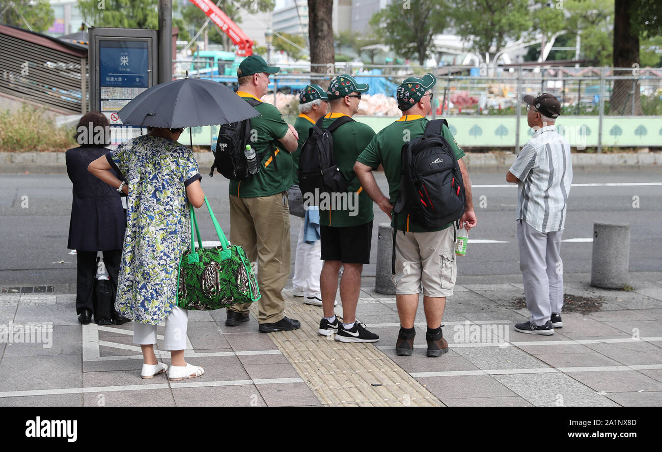 South Africa fans wait for a bus before the 2019 Rugby World Cup match ...