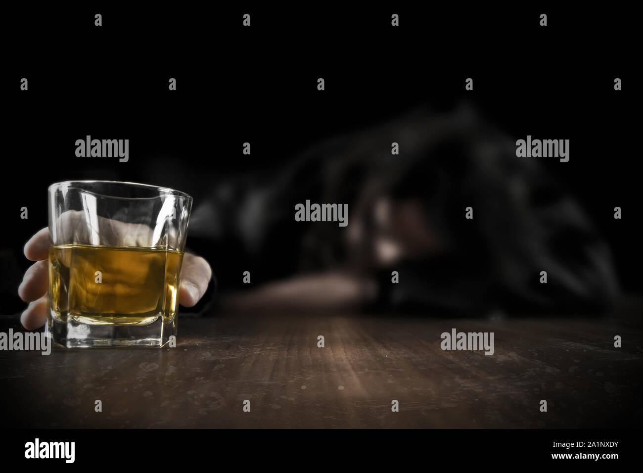 Wasted on the bar after a night of drinking Stock Photo - Alamy