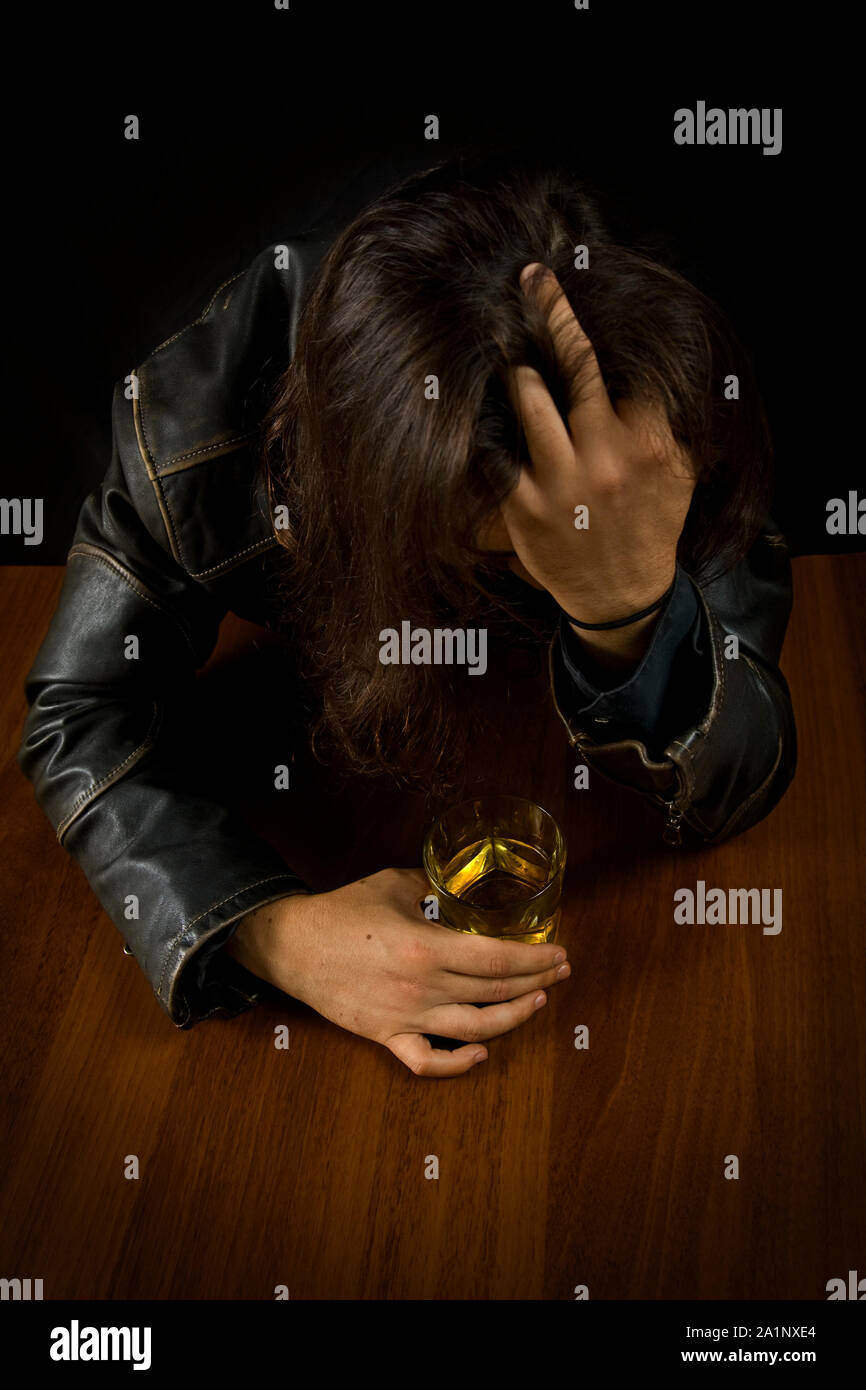 Wasted on the bar after a night of drinking Stock Photo - Alamy