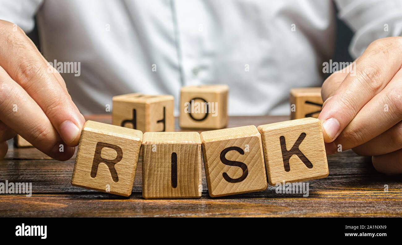 The man carelessly raises the word Risk. High risks in business ...