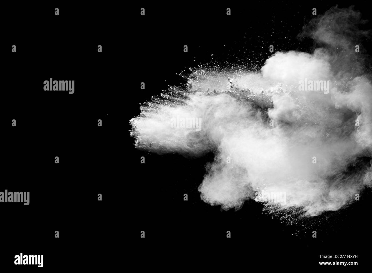 White powder explosion isolated on black background.White dust ...