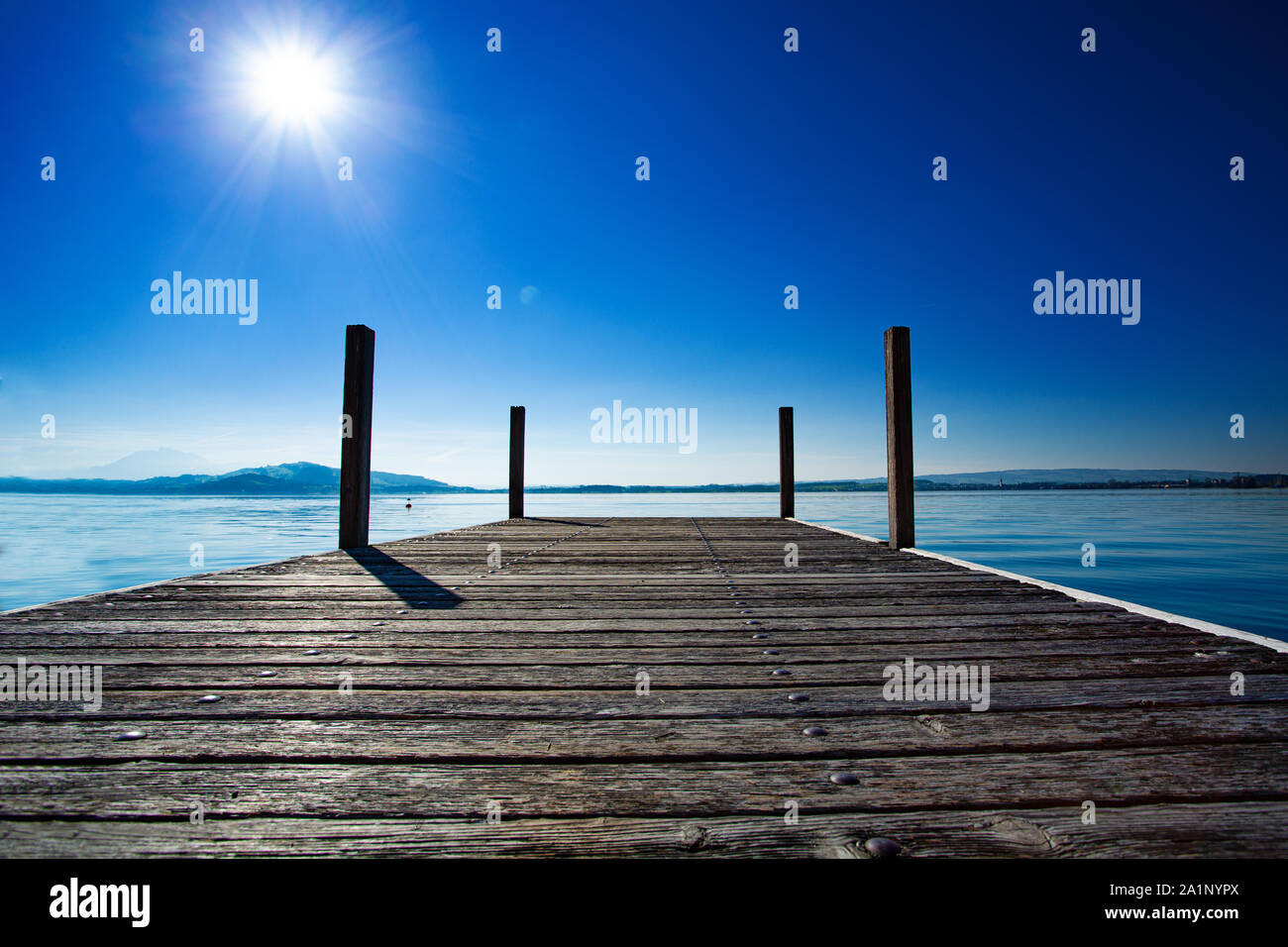 piecefull day on the pier on lake zug, switzerland Stock Photo - Alamy