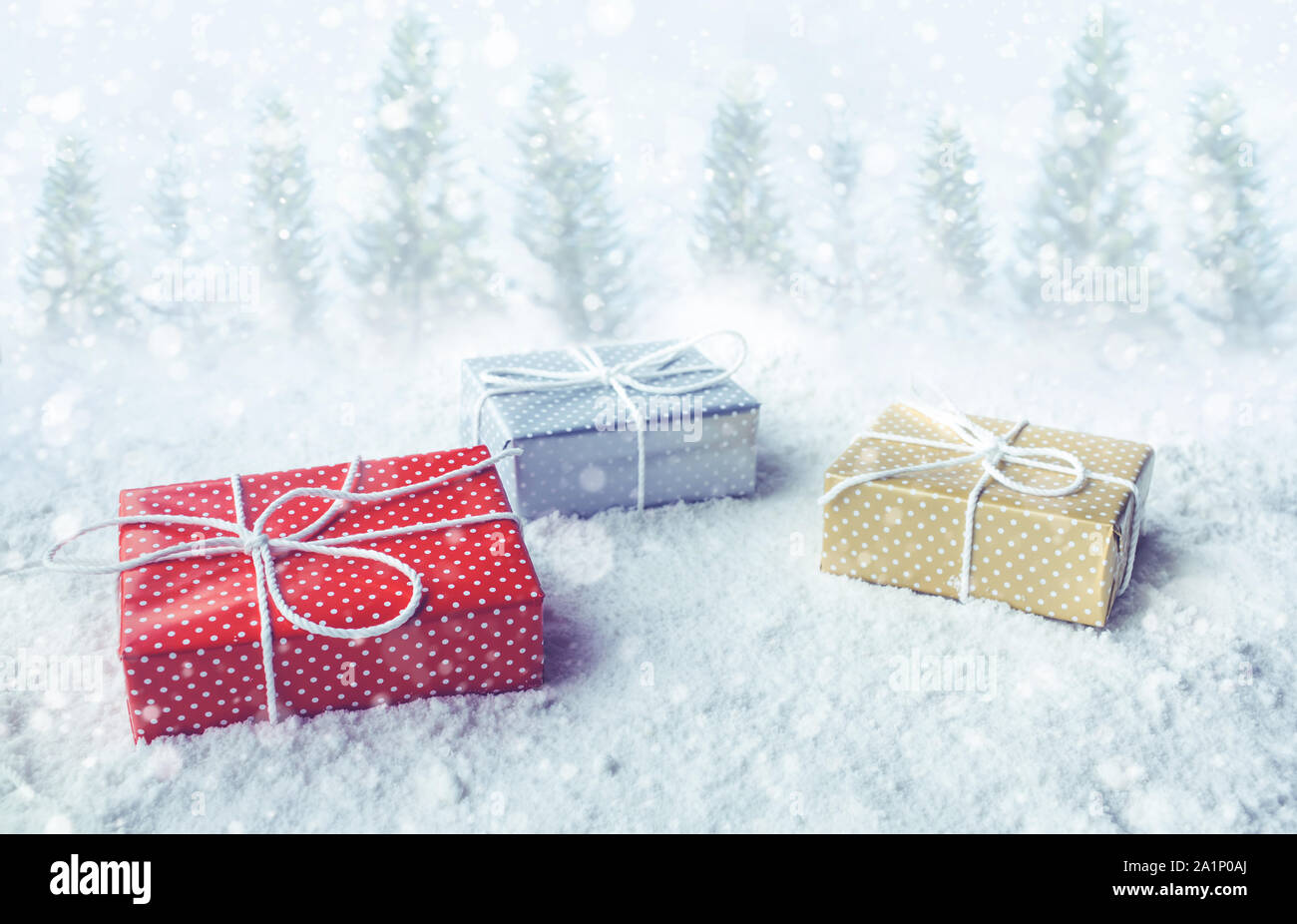 Christmas gift box,present on snow background.For christmas concepts or ...