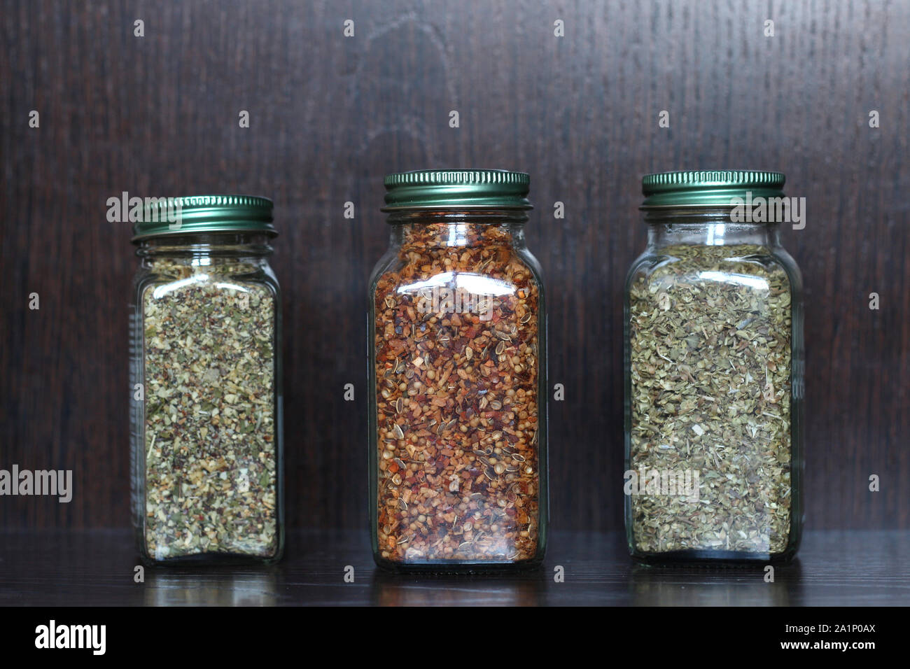 three jars with mixed ground spices Stock Photo - Alamy