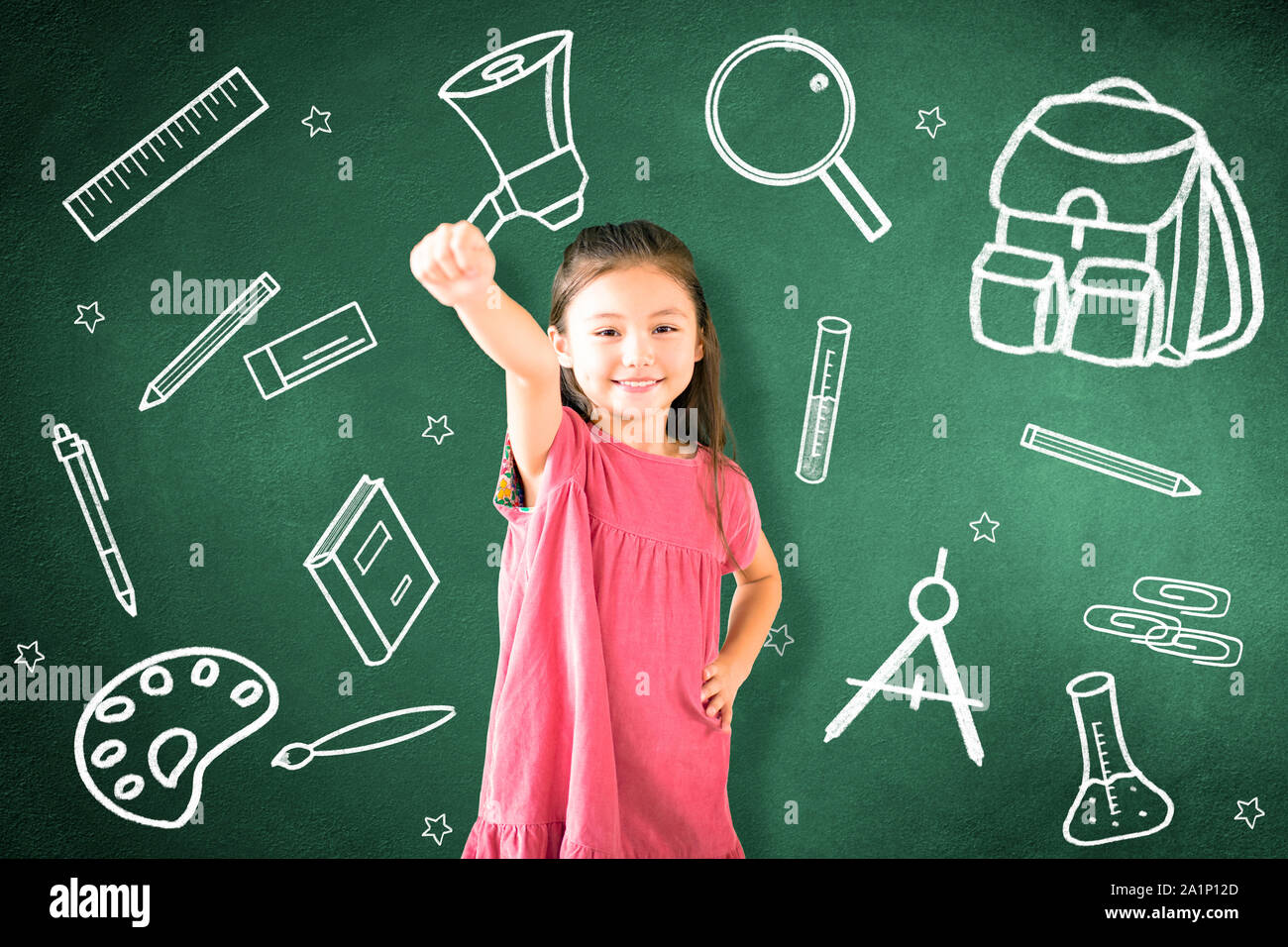 little girl standing against chalkboard and education concept Stock ...
