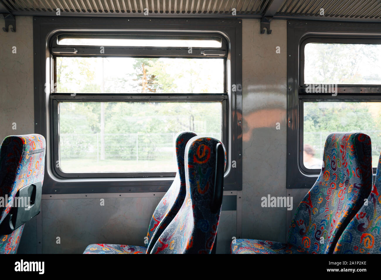 Inside of train with empty seats in Latvia Stock Photo - Alamy