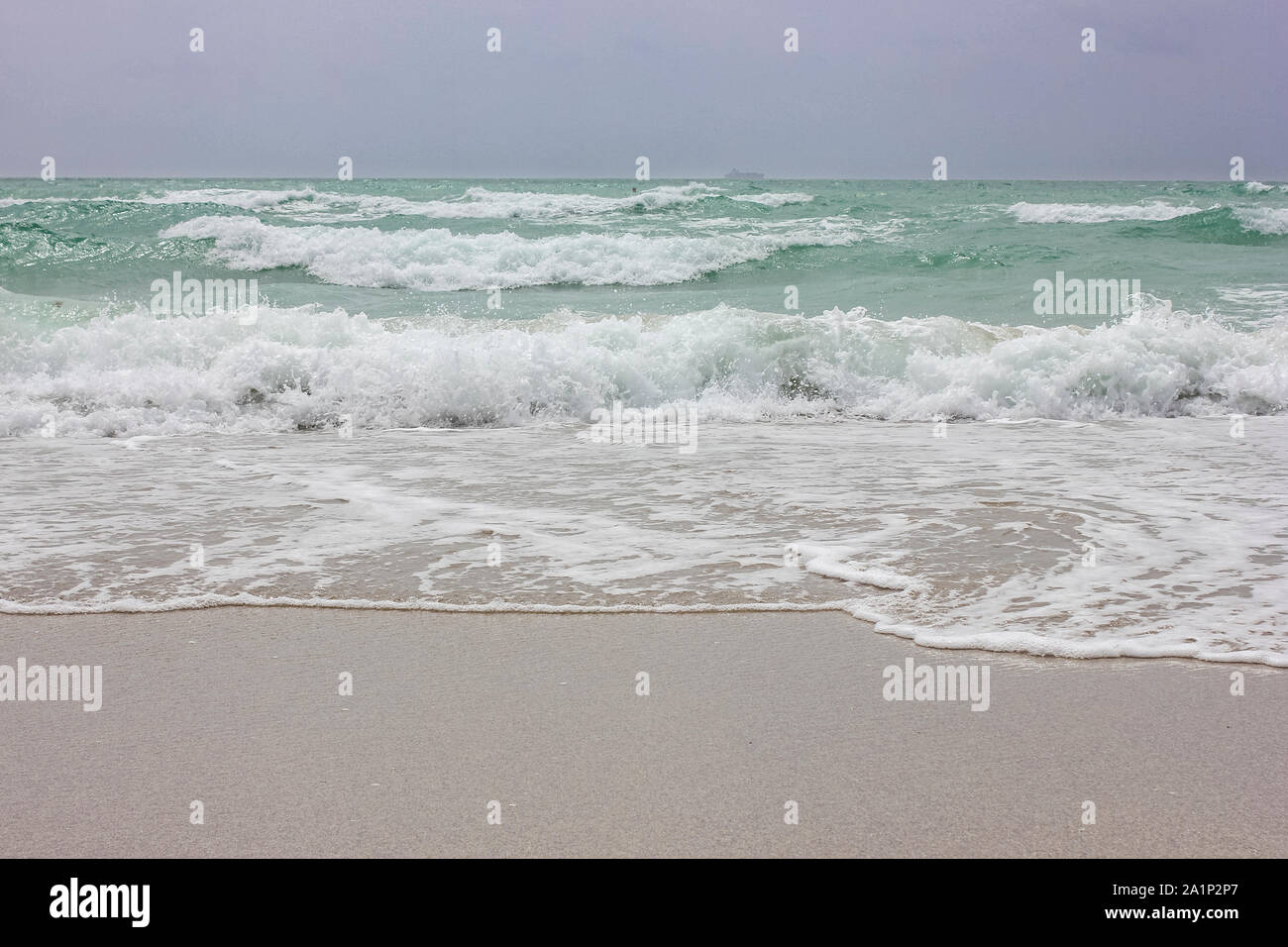 Waves of ocean on beach during daytime Stock Photo - Alamy