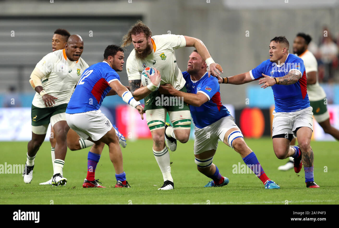 South Africa's RG Snyman goes through Namibia's Peter John Walters and ...