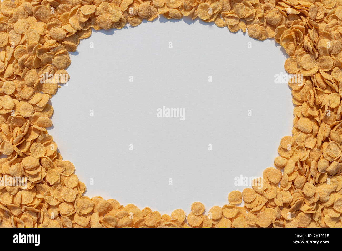 Natural background oval frame of corn flakes Stock Photo - Alamy