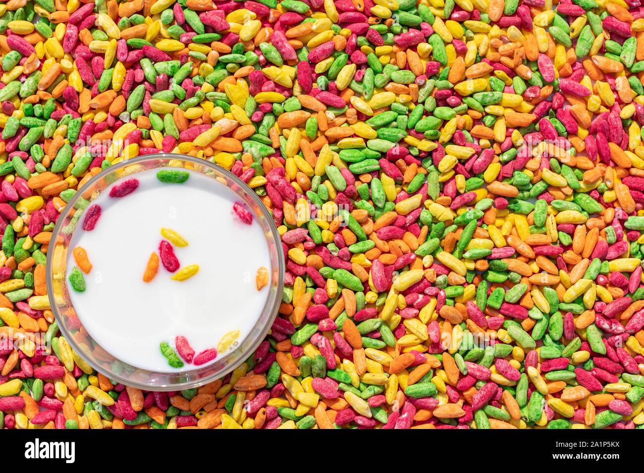 Background from multi-colored rice and cups of milk Stock Photo - Alamy
