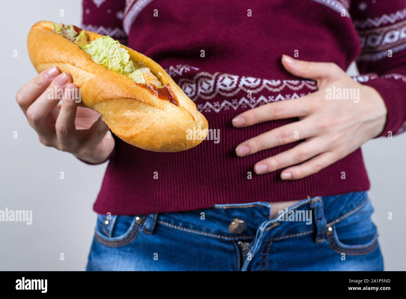 Fast junk food eating concept. Cropped closeup photo of satisfied fed ...