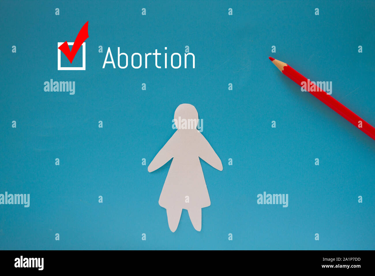 Paper woman and abortion sign. Blue background Stock Photo - Alamy