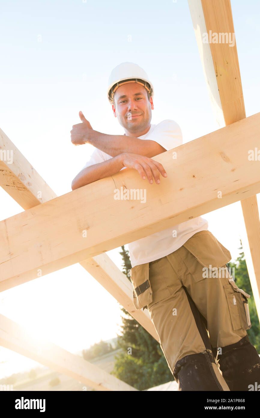 Successful young builder is proud about his project Stock Photo - Alamy