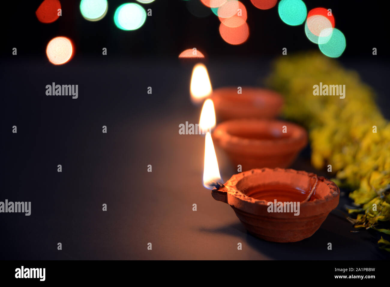 Diwali Diya with marigold flower decoration and gift boxes, for Diwali ...