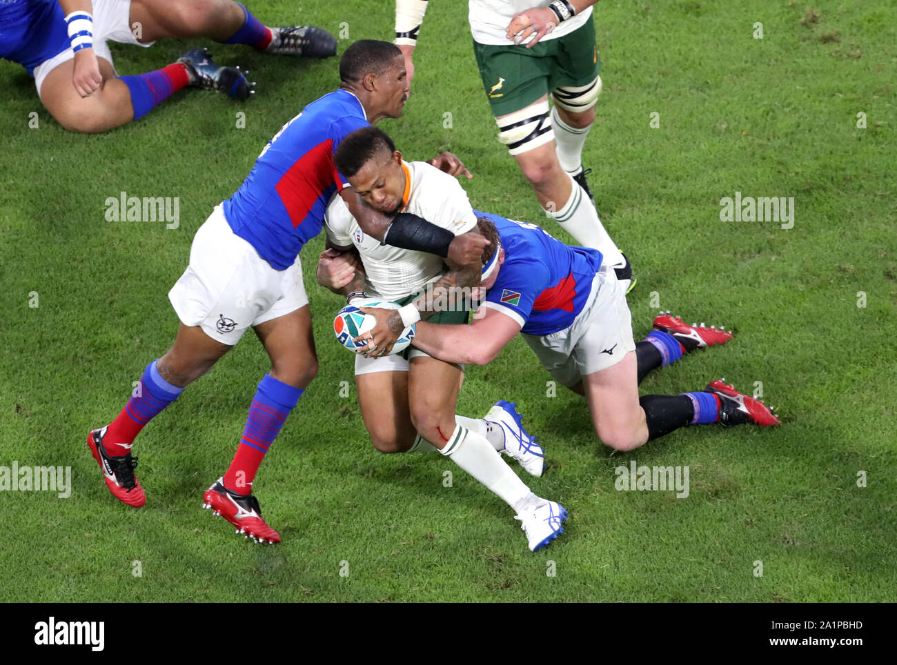 South Africa's Elton Jantjies is tackled by Namibia's Eugene Jantjies ...