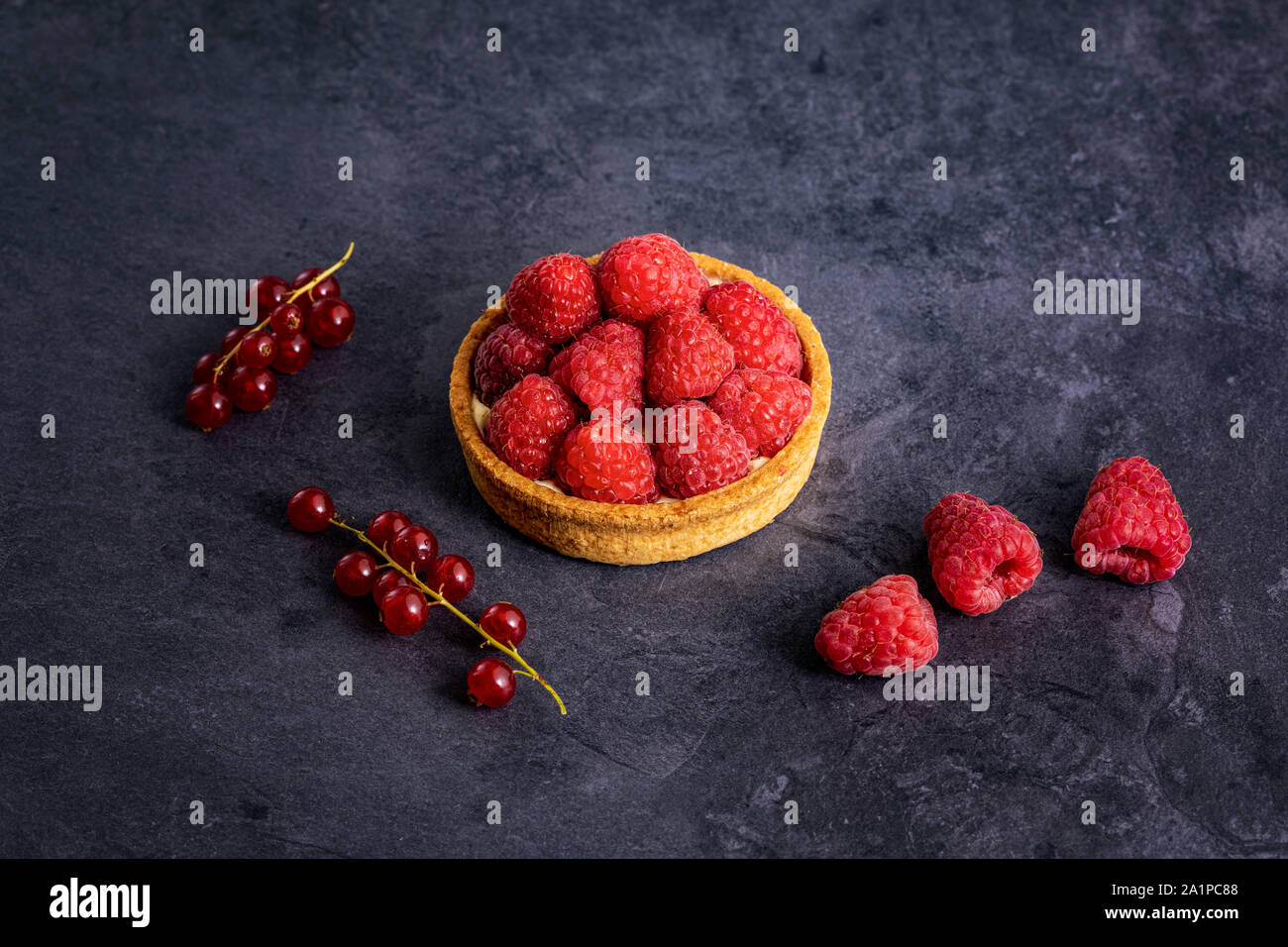 raspberry pie on black stone background Stock Photo - Alamy