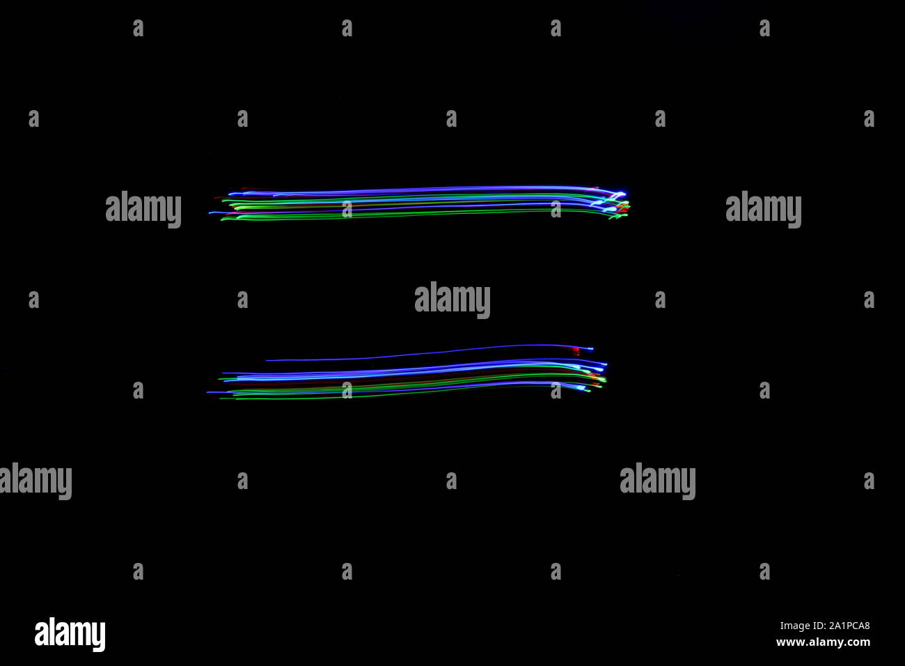 Long exposure photograph of an equals sign, symbol, in neon colour ...