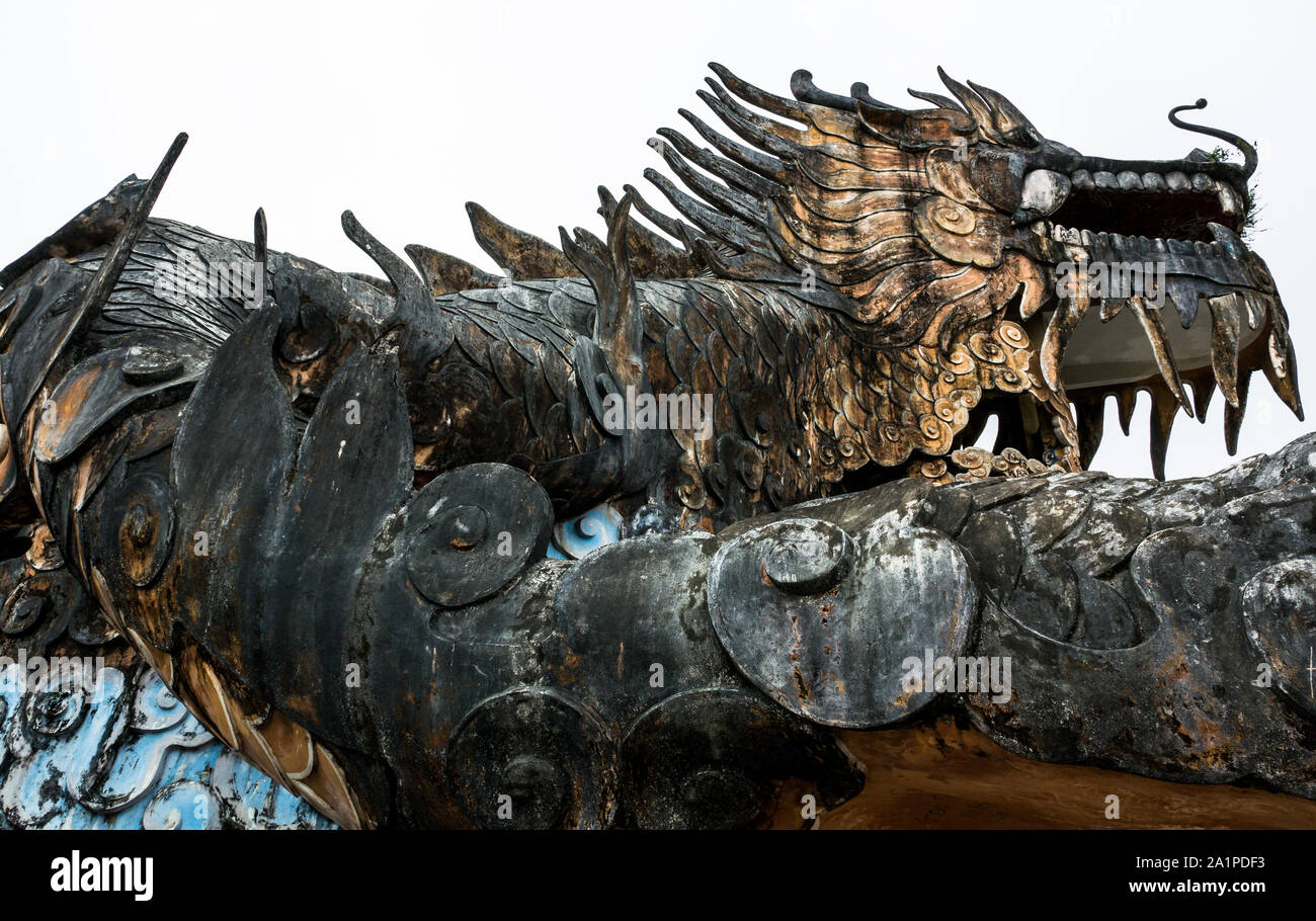 Huge and scary stone dragon with spikes and open mouth with teeth from ...