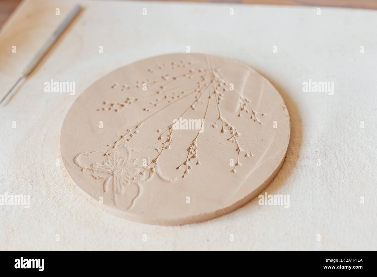 Round painted clay stand Stock Photo - Alamy
